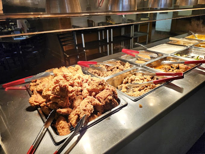 Golden-fried chicken anchors the hot food line, a crispy testament to the simple perfection that keeps locals coming back for seconds.