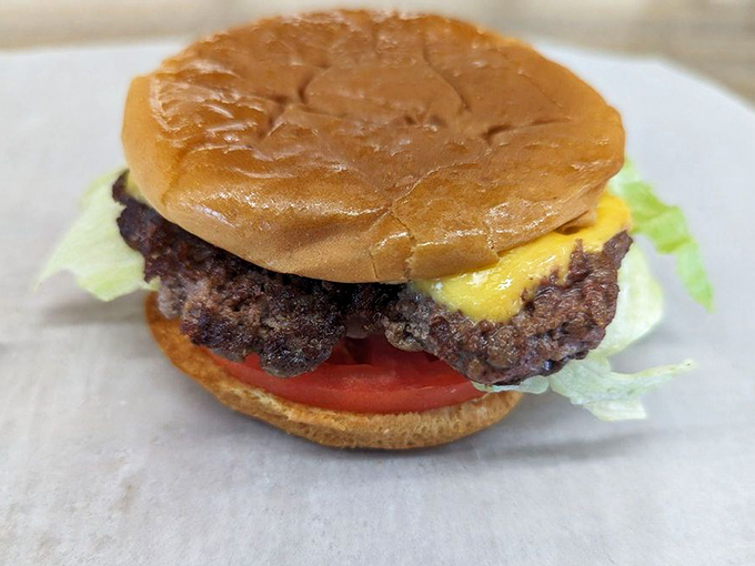 This isn't just a burger; it's edible poetry&mdash;hand-formed patty, melted cheese, fresh veggies, and a perfectly toasted bun create the harmony we all crave.