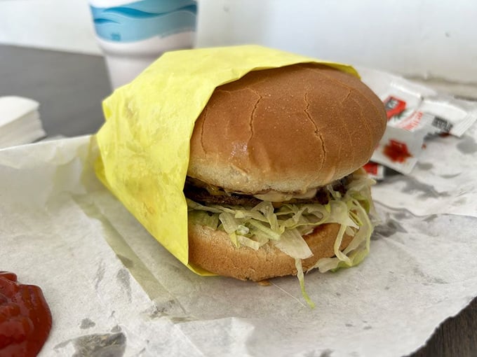 Wrapped in yellow paper like a gift from the burger gods, this classic creation doesn't need fancy toppings to make your taste buds stand at attention.