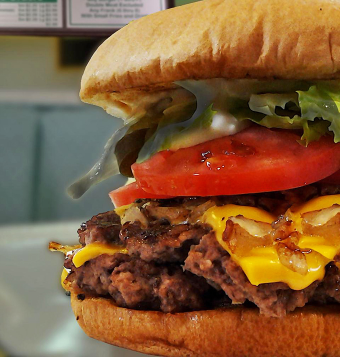 This isn't just a burger &ndash; it's a skyscraper of beef, cheese, and fresh veggies that requires jaw exercises before attempting.