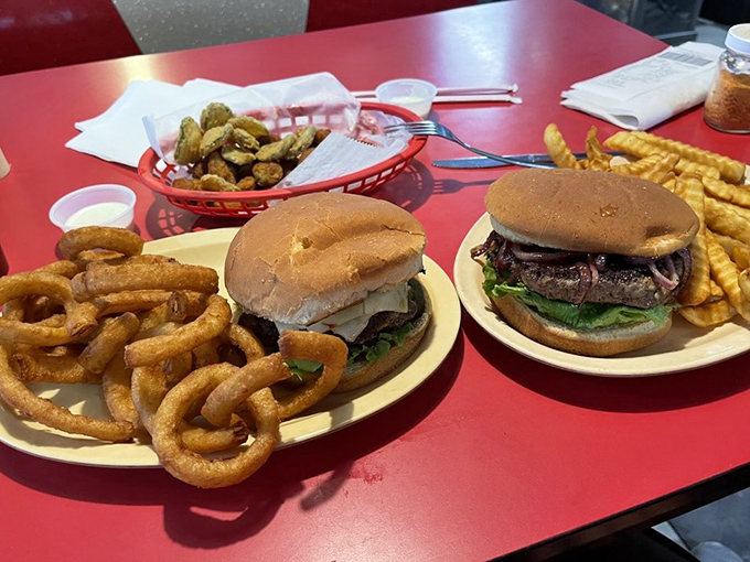Two burgers, golden onion rings, and crispy fries&mdash;a holy trinity of comfort that makes diets weep and cardiologists buy vacation homes.