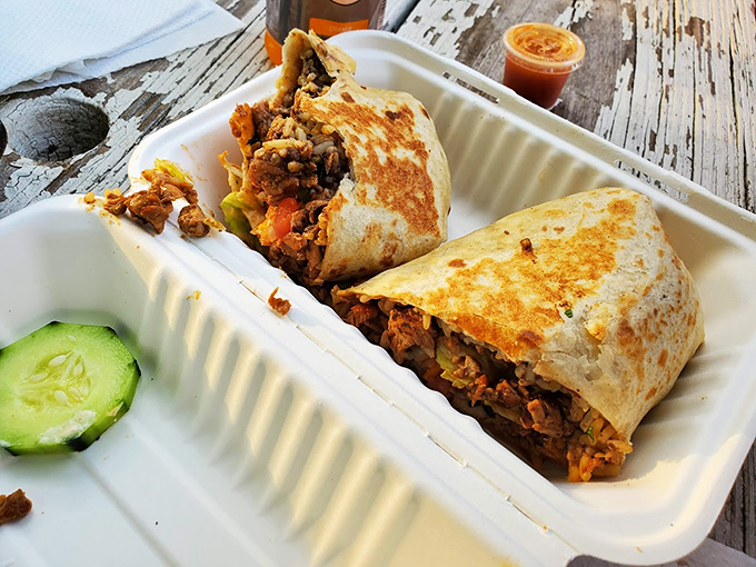 This isn't just a burrito&mdash;it's edible architecture. Perfectly grilled tortilla embracing a harmonious medley of fillings that would make any food critic weep with joy.