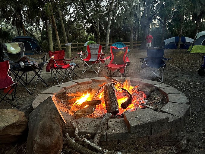 Stone fire rings transform ordinary evenings into primal gatherings where marshmallows meet their delicious demise under starlit Florida skies.
