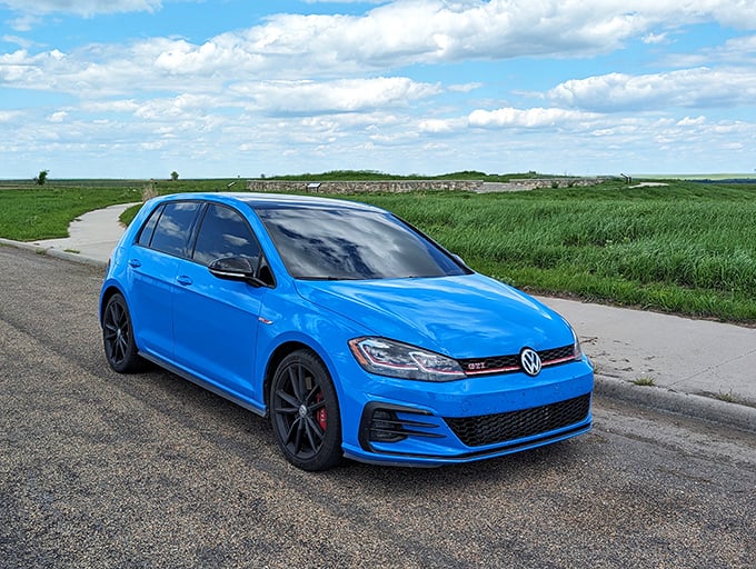 Even this bright blue car seems humbled by the vastness. It's like bringing a kazoo to a symphony.