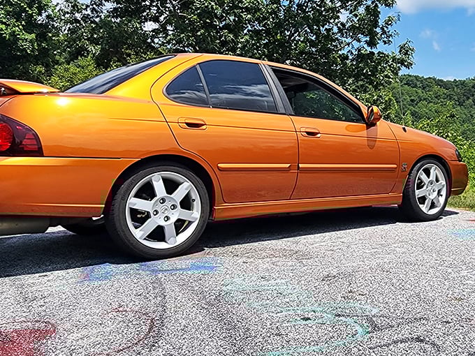 Car enthusiasts know: some vehicles were born for these curves. This vibrant orange sedan seems right at home against North Georgia's backdrop.