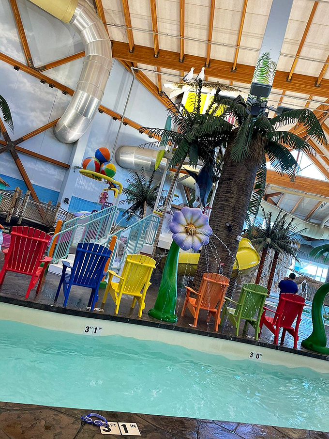 A rainbow coalition of Adirondack chairs stands sentry by the water's edge, like a committee of colorful lifeguards taking a well-deserved break.