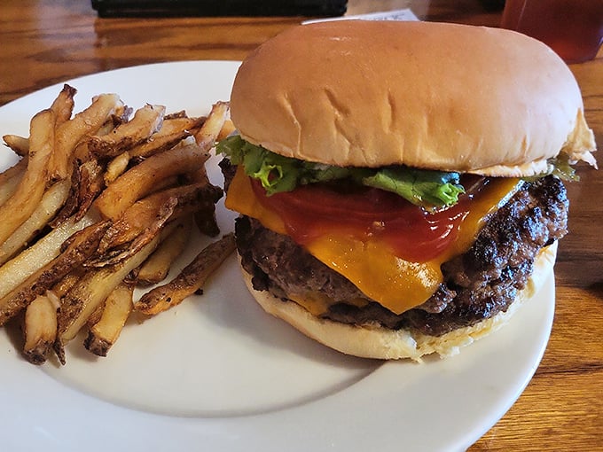 Not all heroes wear capes; some come on a white plate with hand-cut fries and a perfectly melted cheese blanket.