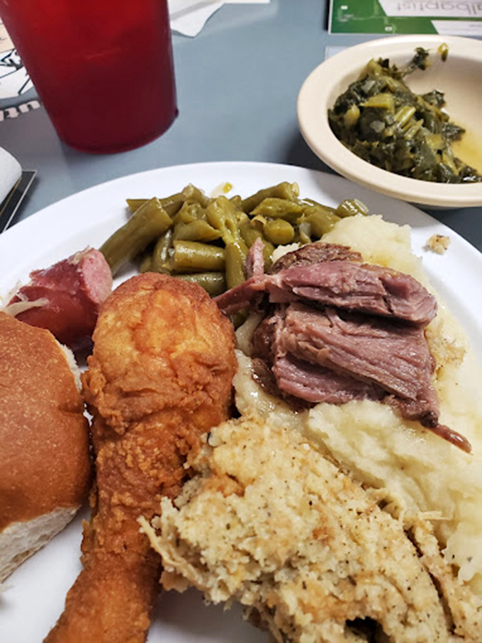 Golden-brown fried chicken that crackles with each bite, sitting alongside cornbread and green beans that would make your grandmother nod in approval. 