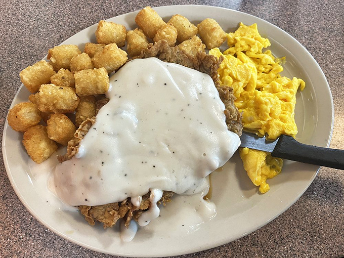Behold the chicken fried steak&mdash;a crispy, golden masterpiece drowning in gravy that makes your cardiologist nervous and your soul happy.
