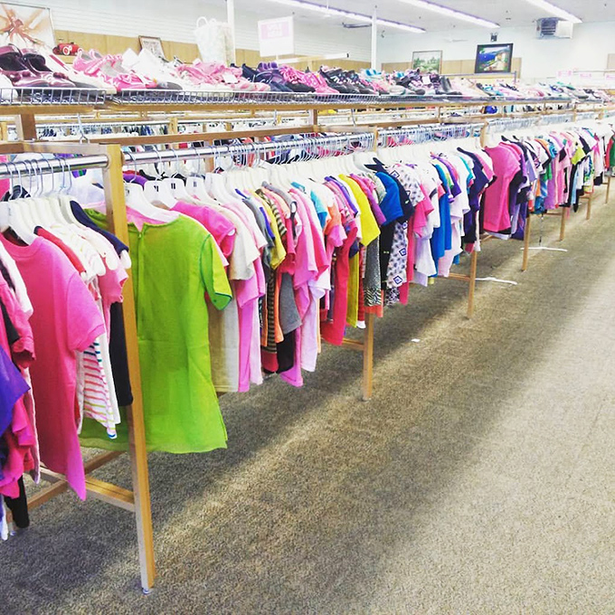 A rainbow road of children's clothing stretches into the distance, proof that kids outgrow their wardrobes faster than parents can say "but I just bought that!"