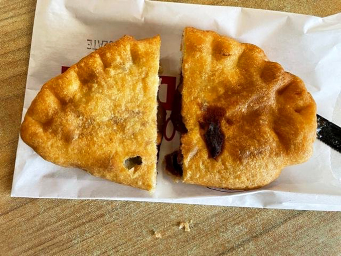 Behold the anatomy of temptation. One bite of this savory masterpiece reveals a perfectly spiced filling that would make any Tex-Mex abuela nod in approval. 