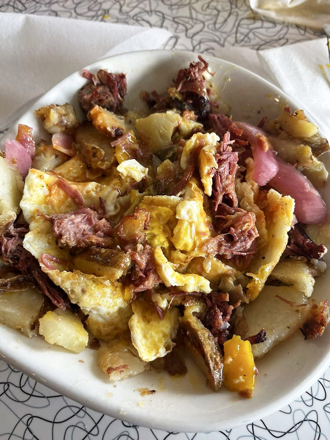 This isn't just corned beef hash&mdash;it's a beautiful mess of crispy potatoes, tender meat, and eggs that could make even your grumpiest morning friend smile.