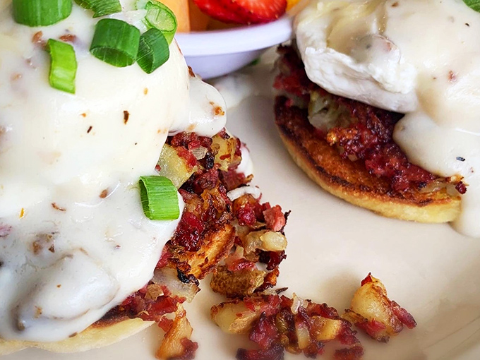Behold the star of the show—corned beef hash crowned with poached eggs and hollandaise, a breakfast masterpiece that's worth setting your alarm for.