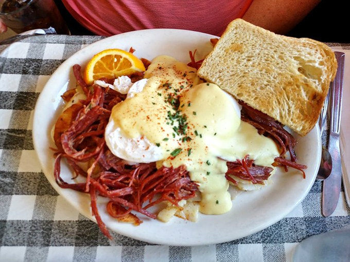 Behold the holy grail of breakfast: corned beef hash crowned with poached eggs and hollandaise. This plate has launched a thousand food pilgrimages.