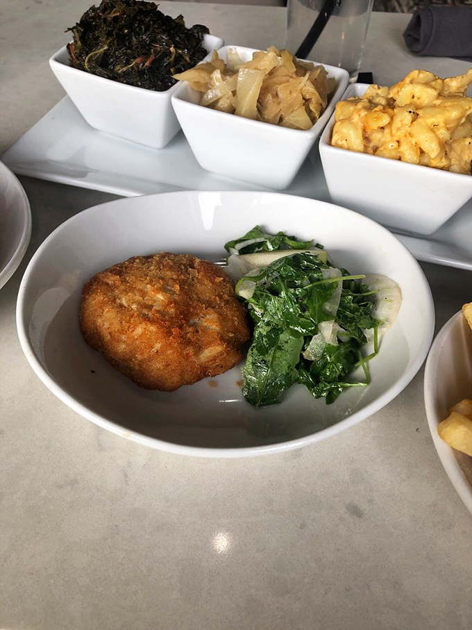 The star of the show&mdash;a golden-brown crab cake that's mostly crab and barely enough breading to hold the party together. Maryland would approve.