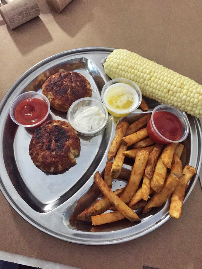 Golden-brown crab cakes that could make a Marylander weep with joy. More crab than cake, served with the holy trinity: fries, corn, and dipping sauces.