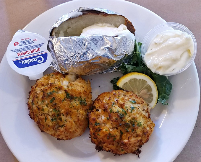 These golden-brown crab cakes aren't just food—they're edible treasure chests packed with sweet lump crab meat and minimal filler. The holy grail of seafood.