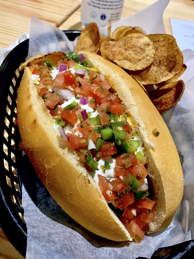 Fresh pico de gallo cascades over this hot dog like confetti at a flavor parade. Those house-made chips aren't just sidekicks&mdash;they're co-stars.