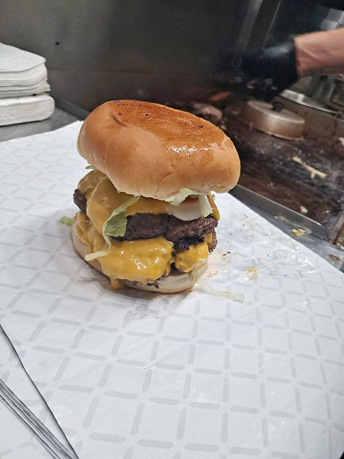 This isn't just a double cheeseburger&mdash;it's a monument to American ingenuity. Two perfectly seasoned patties embraced by melty cheese and a toasted bun.