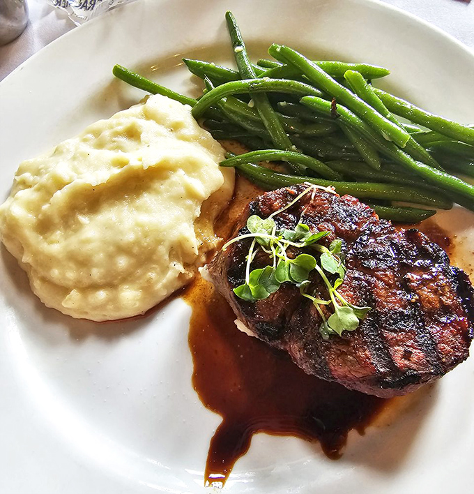 This filet doesn't need a passport to take you places. Perfectly seared, impeccably tender, and paired with sides that know their supporting role without stealing the spotlight.