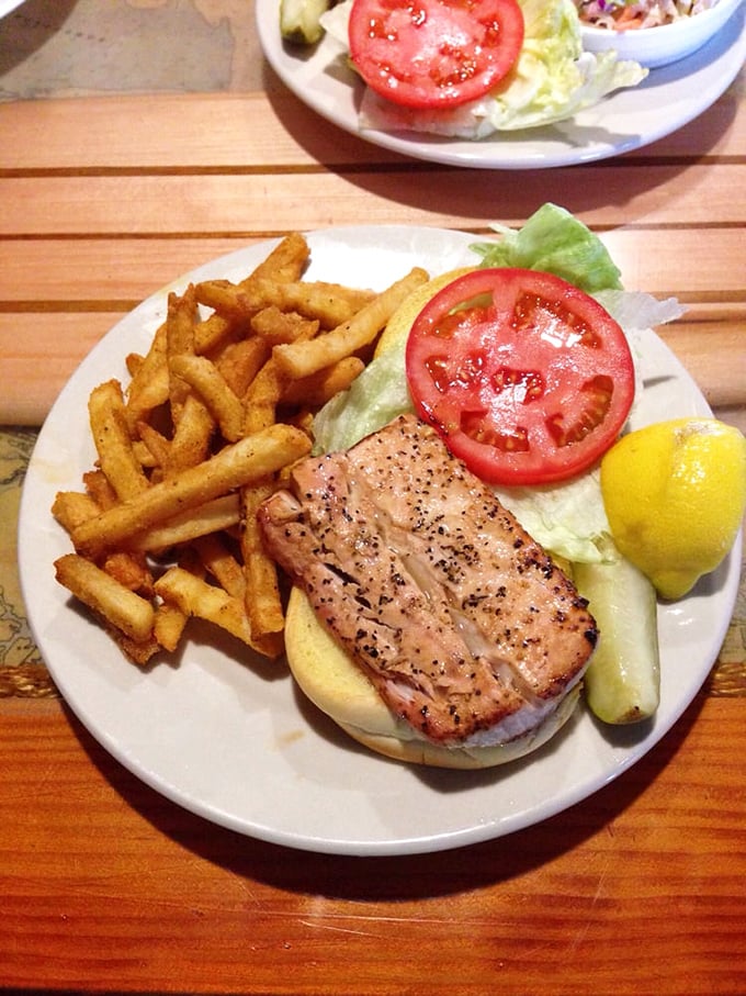 The star of the show: perfectly seasoned fish, golden fries, and that essential lemon wedge. Seafood nirvana on a plate.