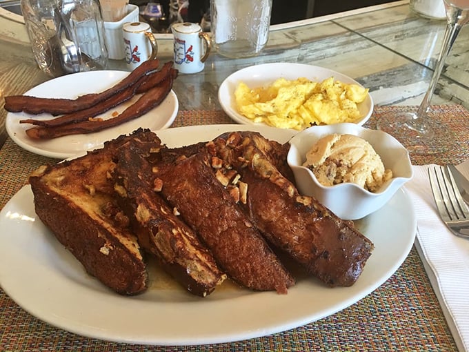 The French toast arrives like a sweet revelation&mdash;golden-brown perfection topped with nuts and ready for its Instagram moment. Maple syrup application should be considered a sacred ritual. 