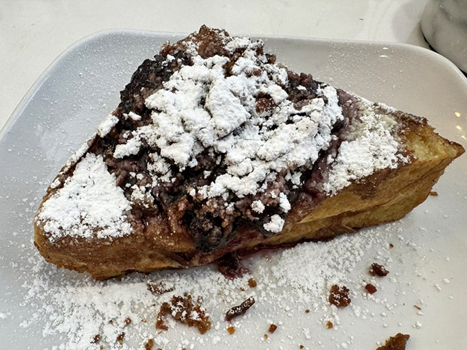 French toast that's had a spa weekend &ndash; relaxed, indulgent, and absolutely glowing with powdered sugar. That scoop of ice cream isn't breakfast, it's destiny.
