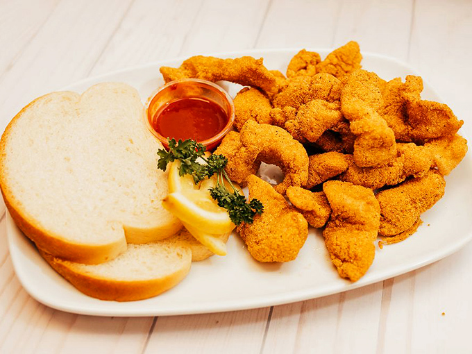 Golden-fried perfection on a plate. This isn't just fish &ndash; it's an edible work of art with bread as the frame.