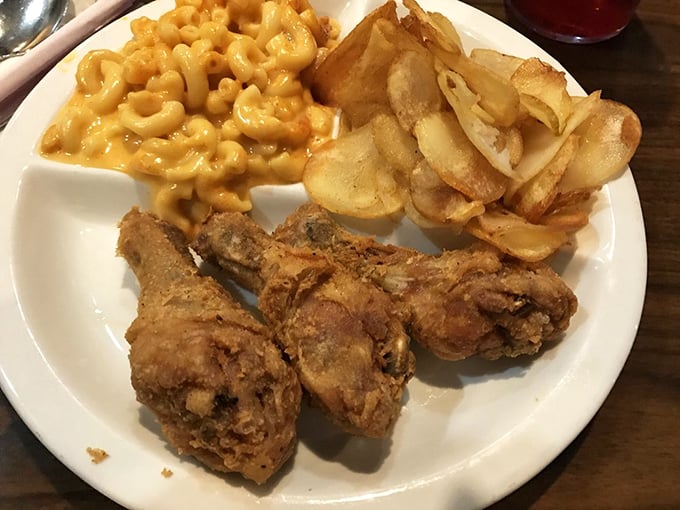 Fried chicken that doesn't need a filter. Two drumsticks standing guard over mac and cheese that's practically declaring itself a vegetable.