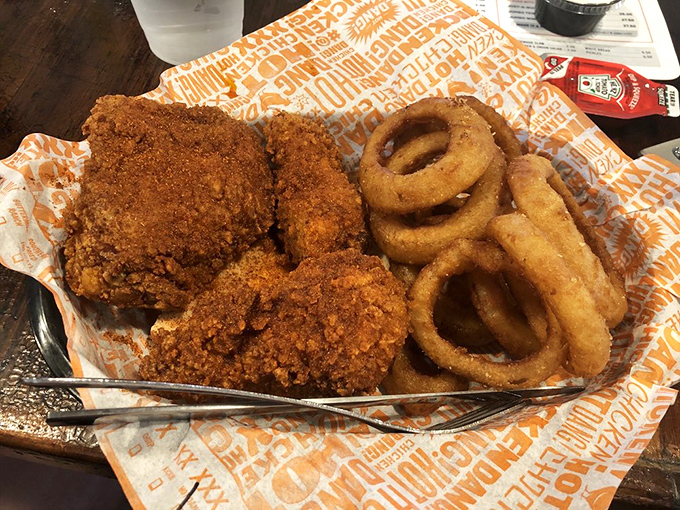 Golden-brown perfection meets crispy onion rings. This basket isn't just food—it's a religious experience with extra crunch on the side.