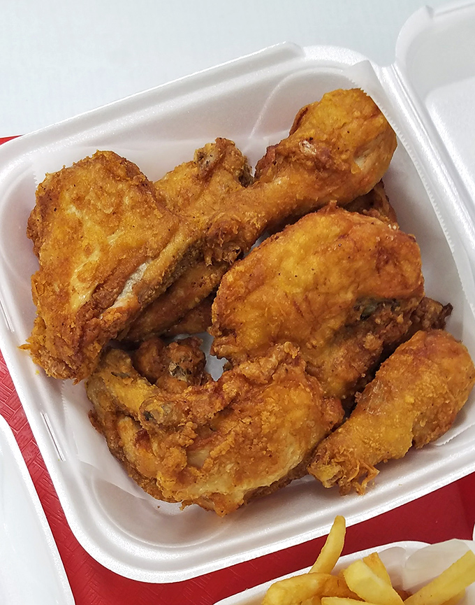 Golden-brown perfection in a takeout container. This isn't just fried chicken; it's edible evidence that simplicity, done right, beats fancy every time.