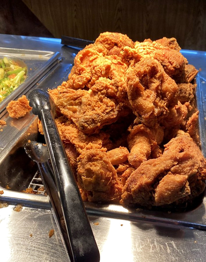 Golden-brown fried chicken that crackles with each bite, stacked high like a delicious game of Jenga. Colonel Sanders would bow in respect.