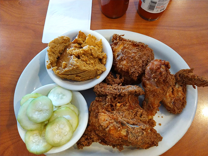 Golden-brown fried chicken that makes you understand why people line up. That crust could win awards for perfect crispiness if awards were given for such things.