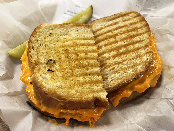 Not your childhood grilled cheese. This golden masterpiece has evolved from elementary school cafeteria to Ph.D in comfort food.