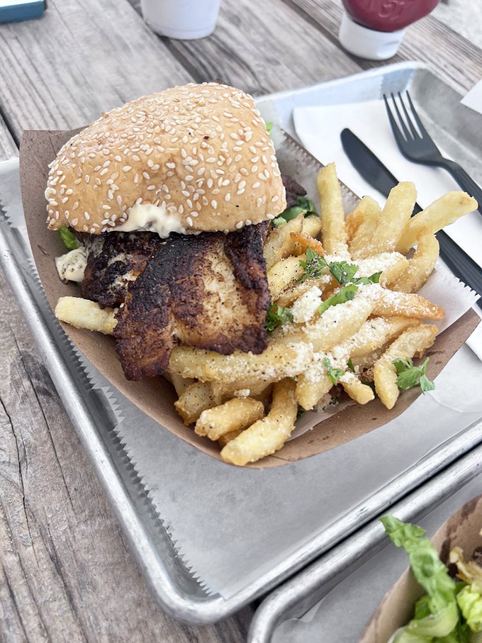 This blackened grouper sandwich isn't just lunch&mdash;it's a Florida rite of passage, served with a side of perfectly seasoned fries that deserve their own fan club.