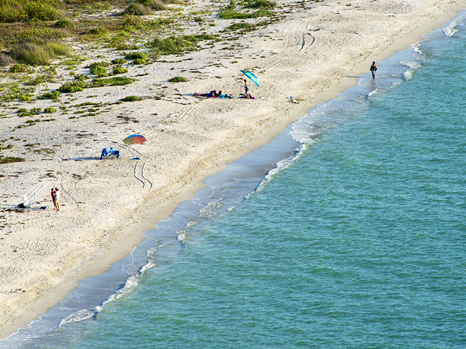 Beachgoers scattered like rare seashells along the shore. When "crowded" means you can see another human being in the distance.