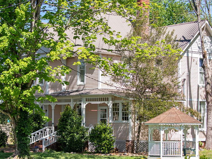 Victorian elegance meets small-town hospitality in this picture-perfect Bell Buckle home. That wraparound porch is practically calling your name.
