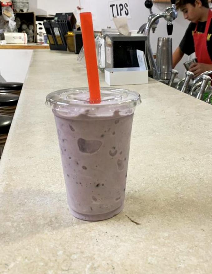 The legendary huckleberry milkshake in its natural habitat. That purple hue isn't food coloring&mdash;it's pure Idaho mountain goodness in liquid form.