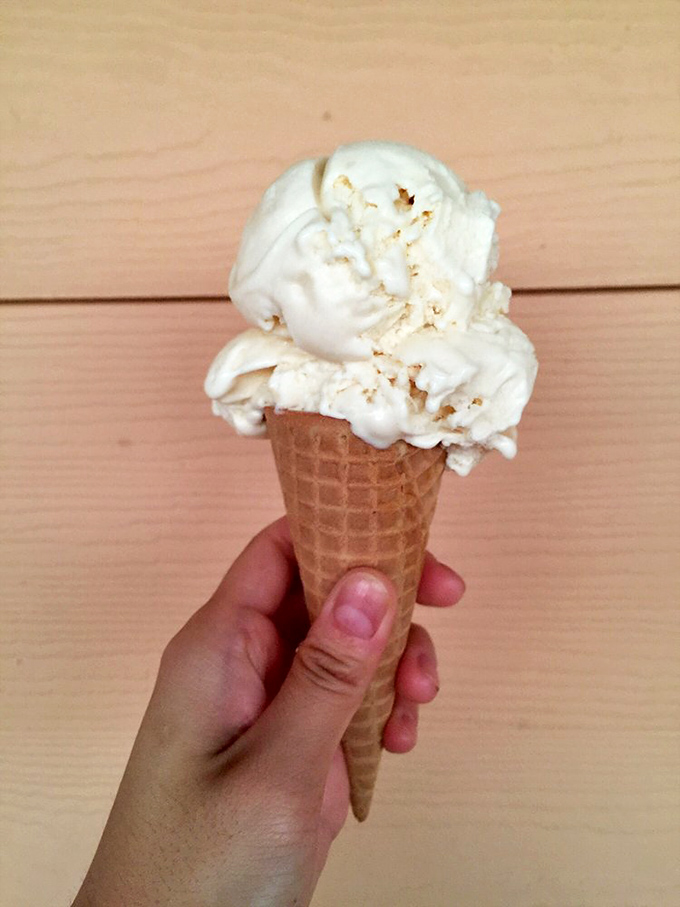 This vanilla cone isn't just dessert, it's therapy in edible form. Notice how perfectly it's scooped &ndash; that's the mark of professionals.