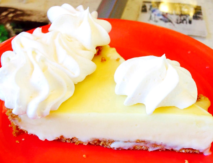 The legendary Key lime pie in all its yellow (never green!) glory. That cloud of whipped cream isn't garnish&mdash;it's the cumulus to the custard's sunshine.