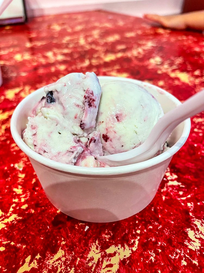 This berry-swirled masterpiece isn't just ice cream&mdash;it's summer captured in a cup, with ribbons of blueberry jam dancing through creamy dreams.