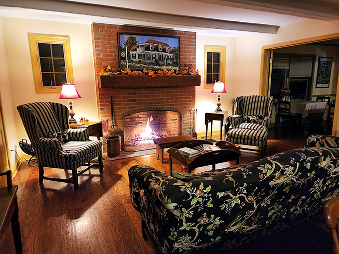 A crackling fire in this living room practically begs you to sink into those striped chairs with a good book or better yet, a glass of wine.