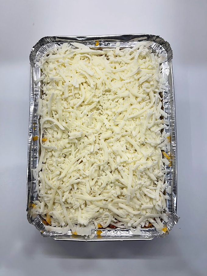 Behold the cheese-crowned glory that makes diets weep. This lasagna doesn't just feed the body&mdash;it nourishes the soul with every gooey, stretchy bite.