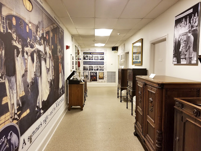 The museum's corridor serves as a time tunnel, with vintage advertisements and wooden cabinets whispering stories of America's first musical revolution.