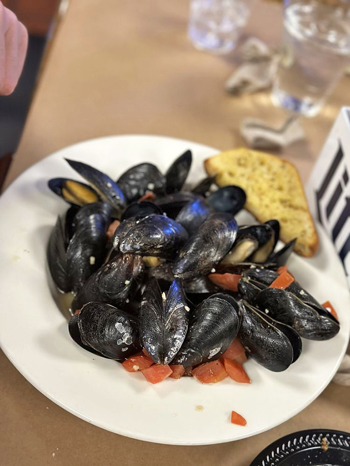 These glistening mussels aren't just seafood&mdash;they're little black pearls of the ocean, steamed to perfection and ready for their butter bath.