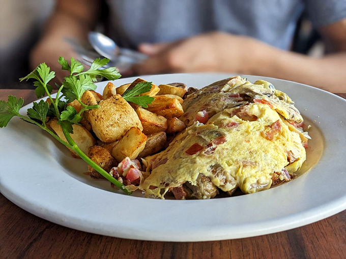 Behold the omelet of your dreams&mdash;a fluffy golden envelope stuffed with treasures. Those breakfast potatoes deserve their own fan club and postal code.