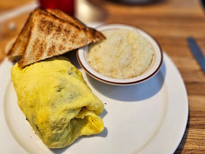 Behold the perfect omelet&mdash;fluffy on the outside, stuffed with goodness on the inside, paired with grits that would make any Southerner proud.