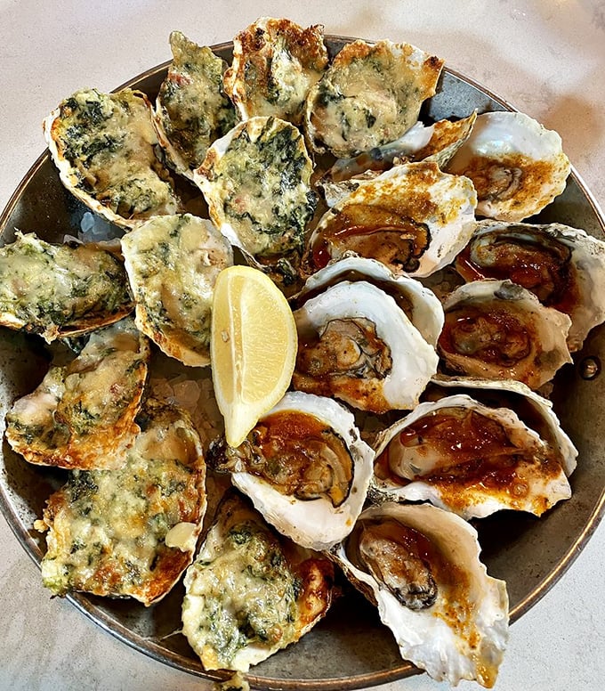 Oysters three ways &ndash; nature's perfect appetizer getting the royal treatment. That lemon wedge is about to make everything sing.
