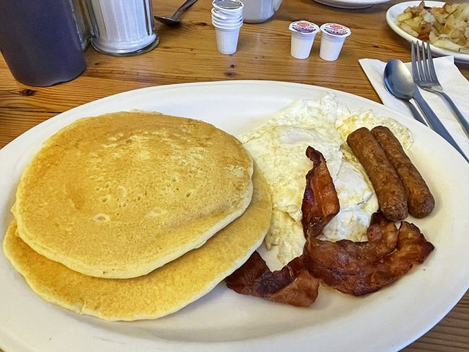 Golden pancakes sharing a plate with perfectly cooked eggs and bacon &ndash; the breakfast trinity that's converted more morning skeptics than coffee itself.