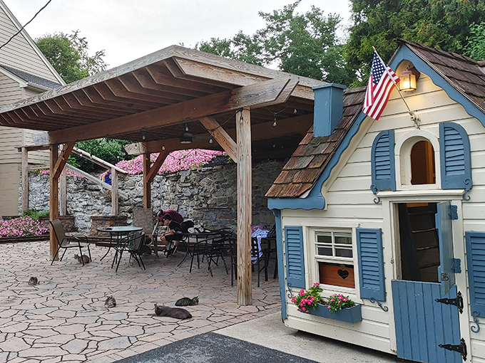 A charming playhouse and covered patio create the perfect backdrop for making memories—like a movie set for your own personal countryside escape.